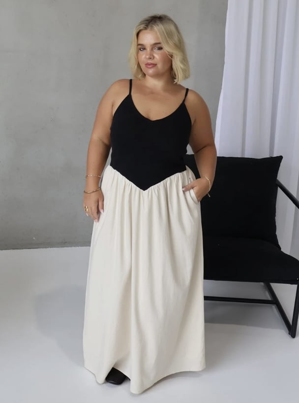 woman wearing black and white dress from Fayt The Label.